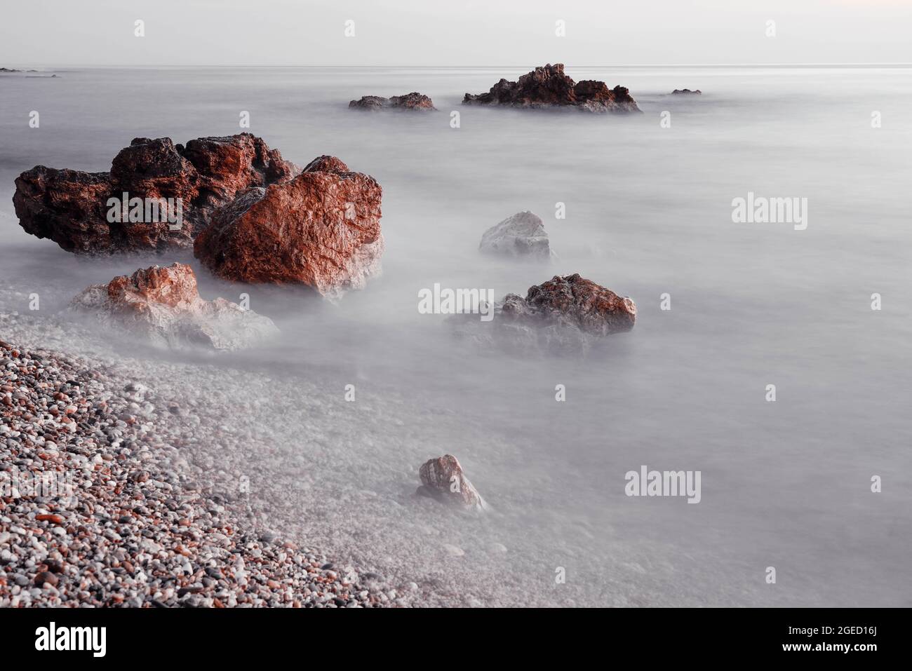 Long Exposure Sunset on Beach Photo with Rocks Stock Photo - Alamy
