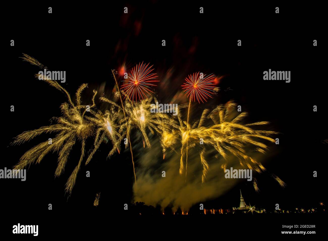 Huge, colorful fireworks over the rice fields at dusk Stock Photo - Alamy