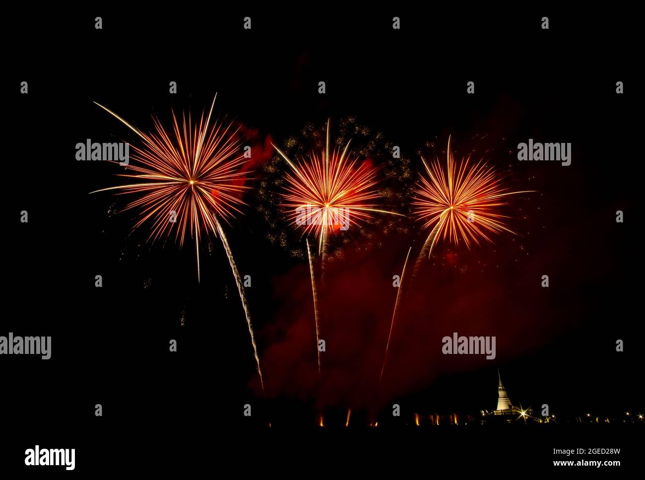 Huge, colorful fireworks over the rice fields at dusk Stock Photo - Alamy