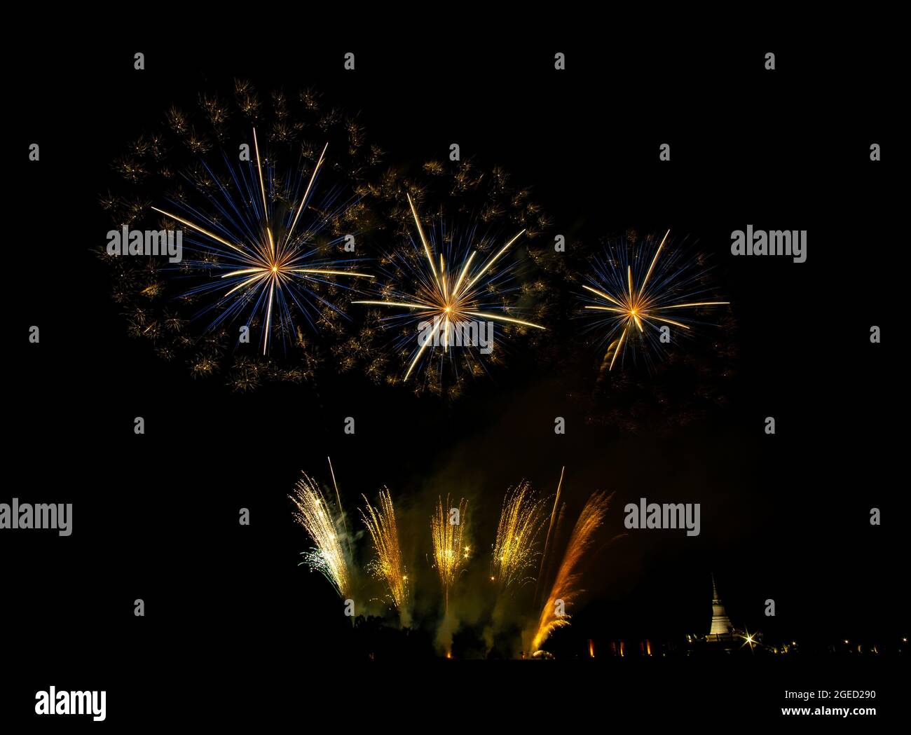 Huge, colorful fireworks over the rice fields at dusk Stock Photo - Alamy