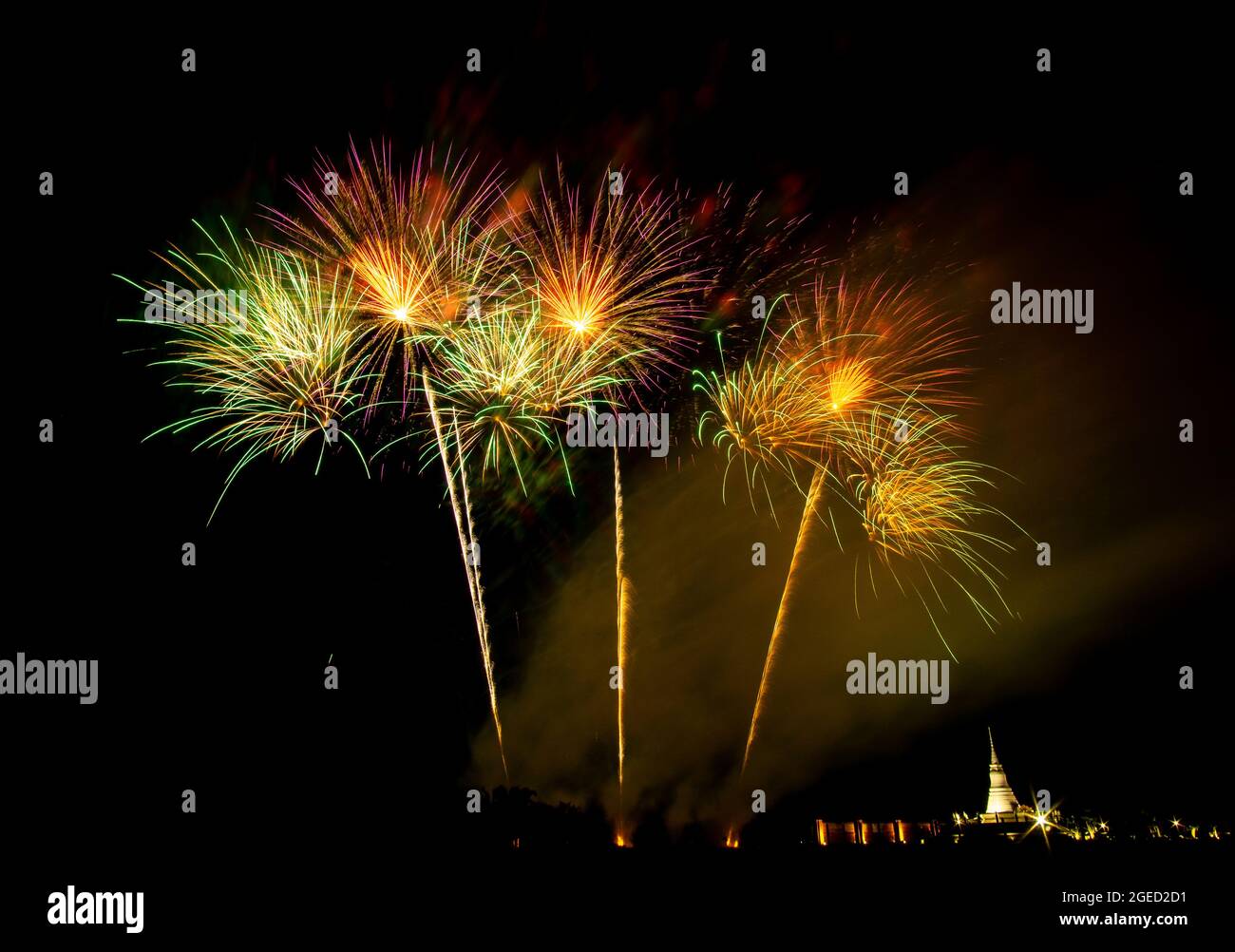 Huge, colorful fireworks over the rice fields at dusk Stock Photo - Alamy