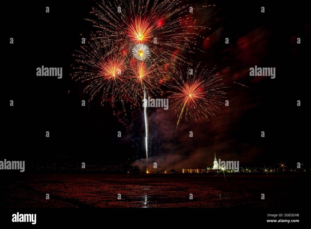 Huge, colorful fireworks over the rice fields at dusk Stock Photo - Alamy