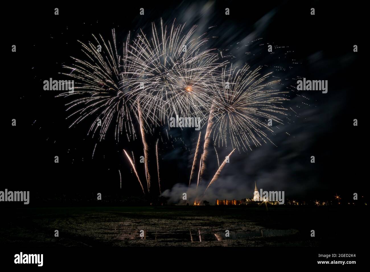Huge, colorful fireworks over the rice fields at dusk Stock Photo - Alamy