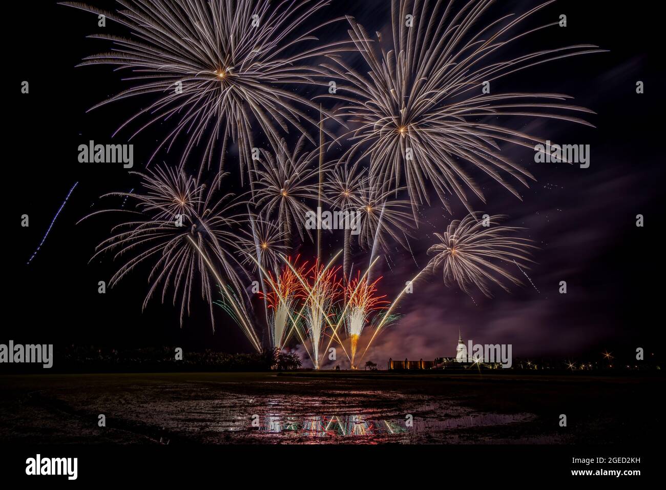 Huge, colorful fireworks over the rice fields at dusk Stock Photo - Alamy