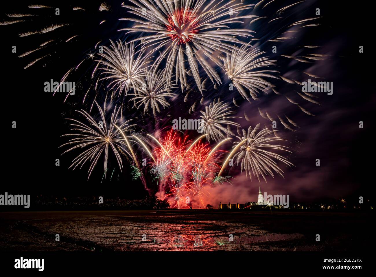 Huge, colorful fireworks over the rice fields at dusk Stock Photo - Alamy