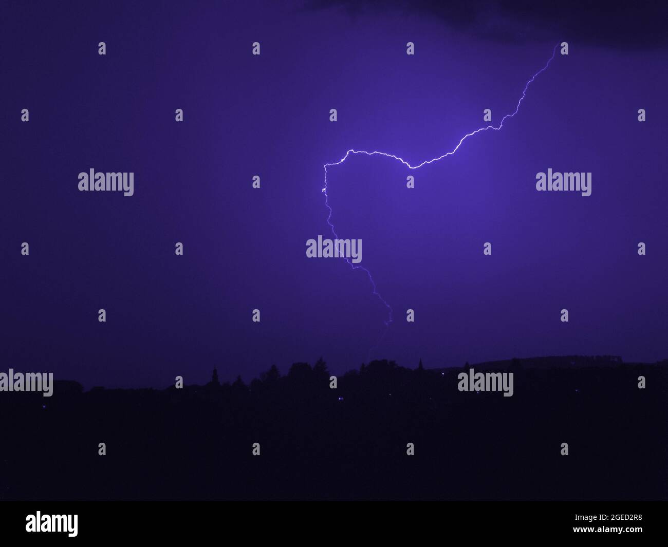 Eerie scenery of a lightning strike at night Stock Photo - Alamy
