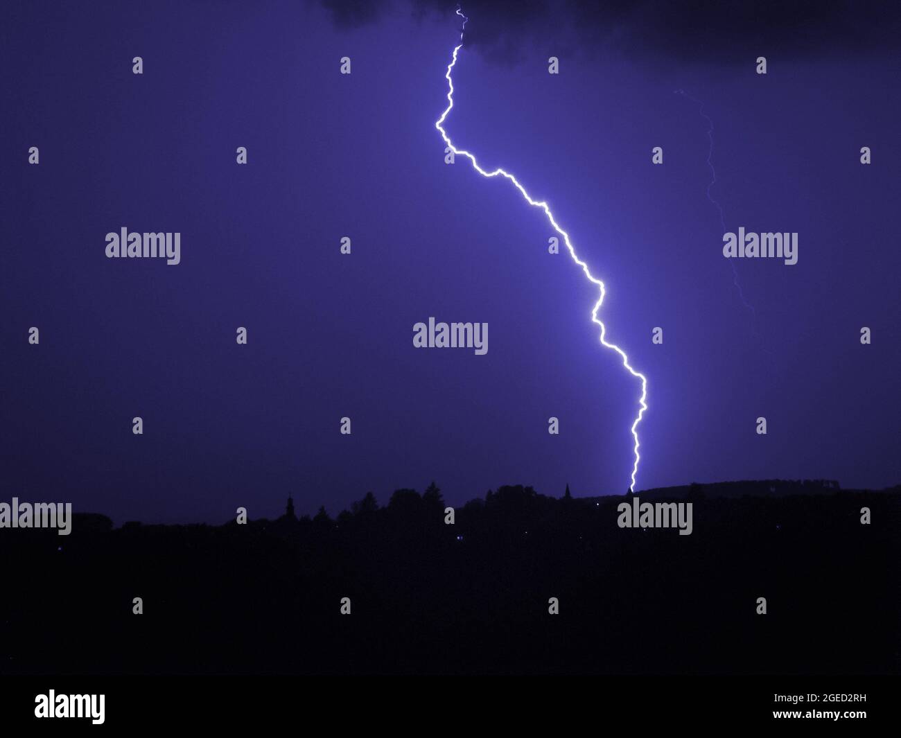 Eerie scenery of a lightning strike at night Stock Photo - Alamy
