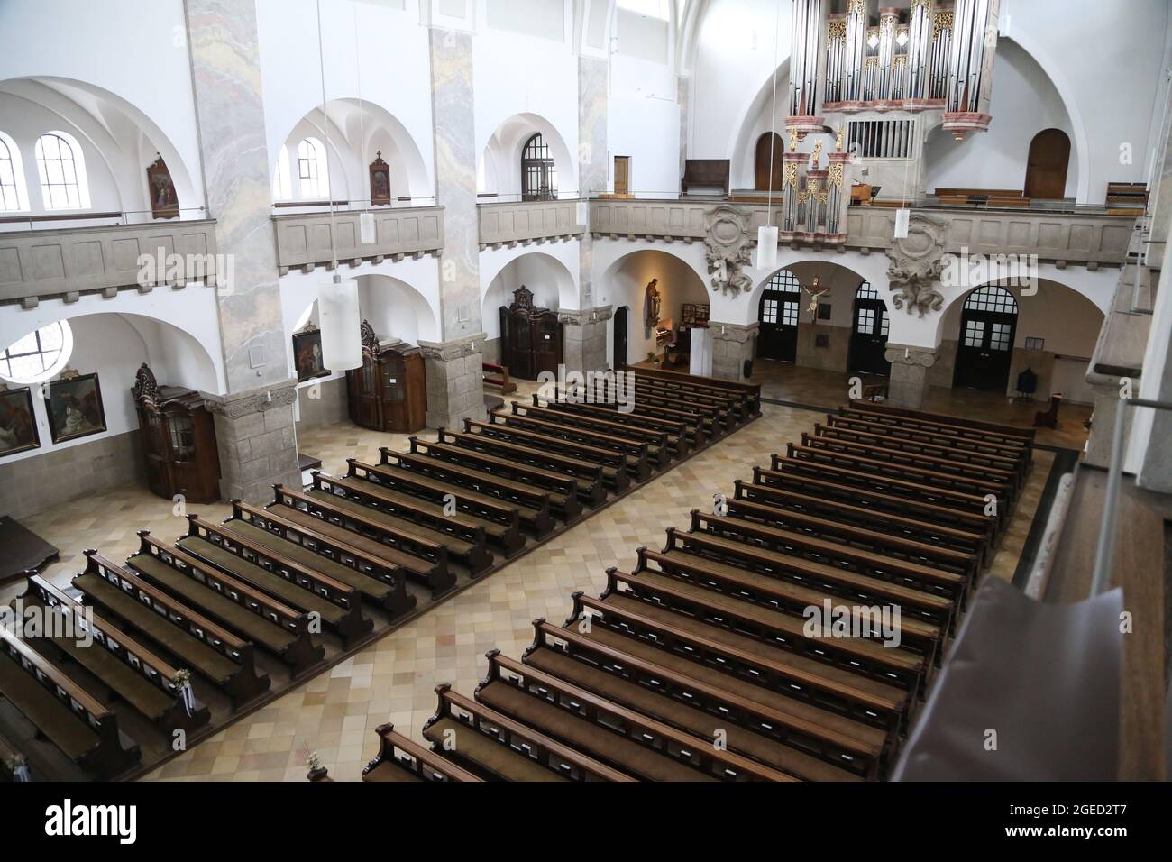Gorgeous overhead shot of the interior of a church in Germany with rows ...
