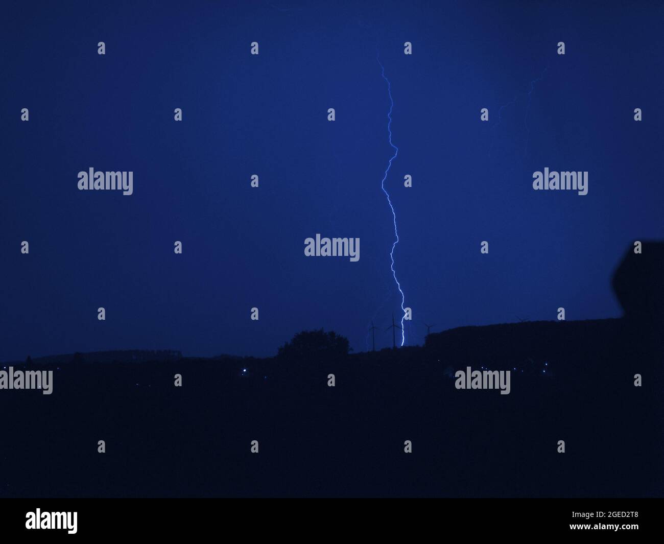 Eerie scenery of a lightning strike at night Stock Photo - Alamy