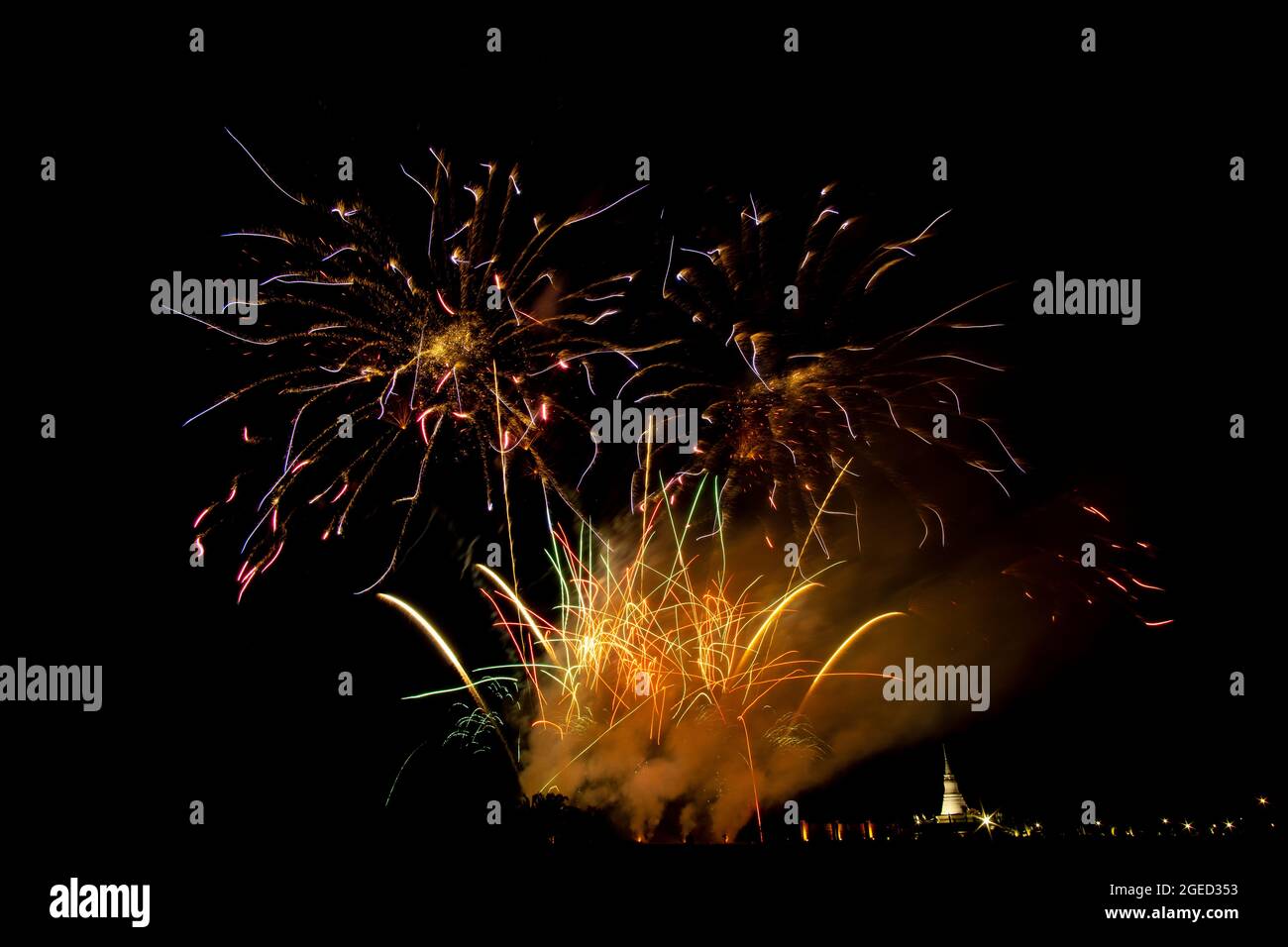 Huge, colorful fireworks over the rice fields at dusk Stock Photo - Alamy