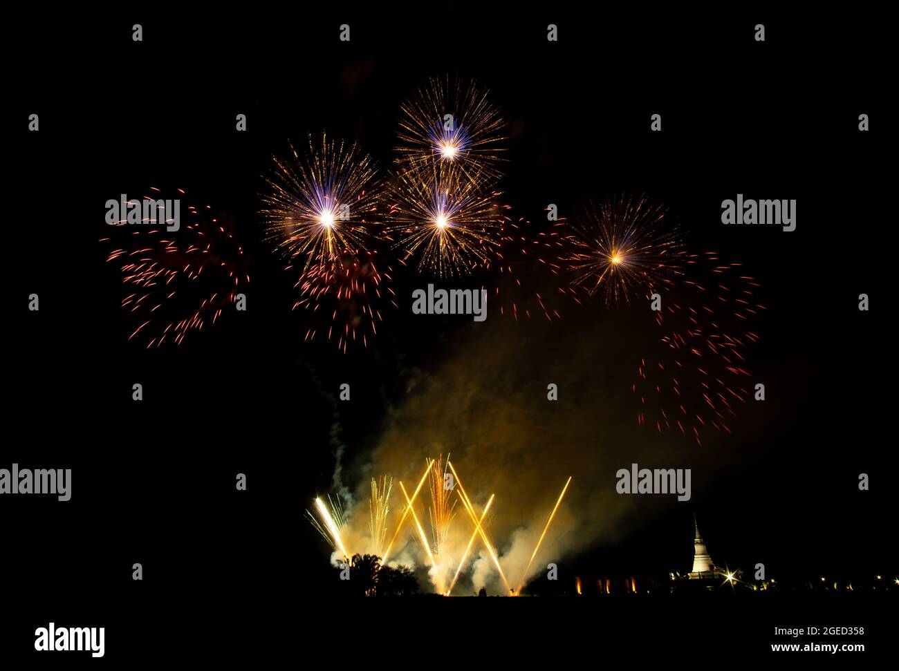 Huge, colorful fireworks over the rice fields at dusk Stock Photo - Alamy