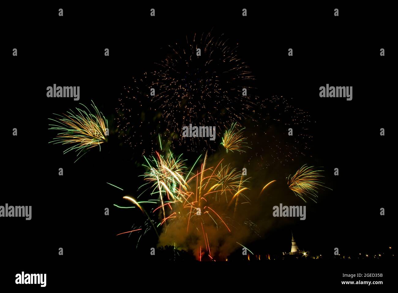 Huge, colorful fireworks over the rice fields at dusk Stock Photo - Alamy