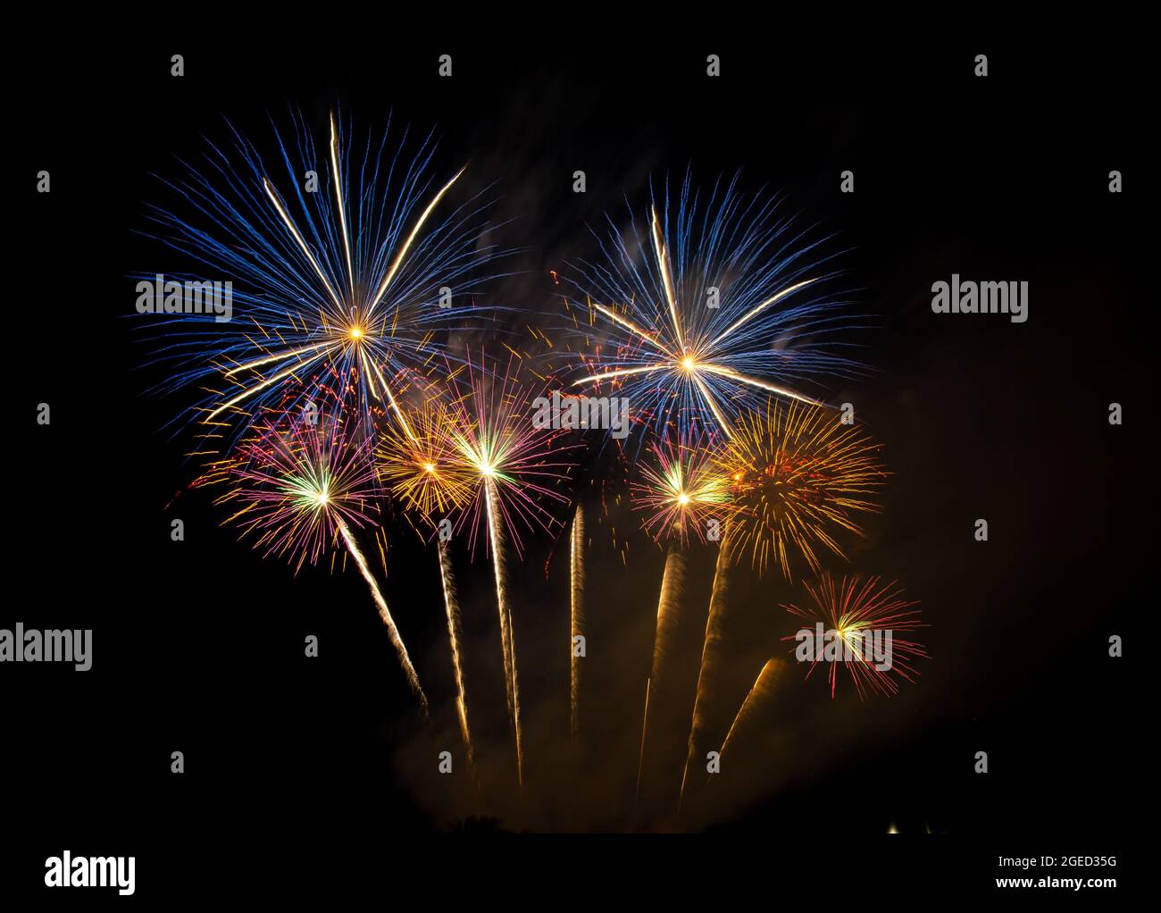 Huge, colorful fireworks over the rice fields at dusk Stock Photo - Alamy