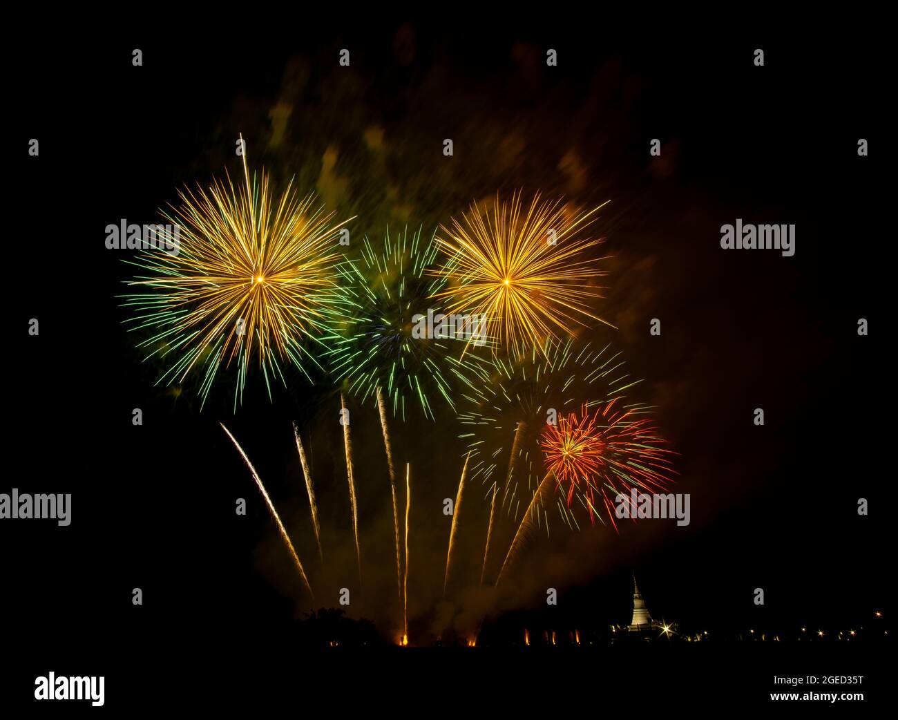 Huge, colorful fireworks over the rice fields at dusk Stock Photo - Alamy