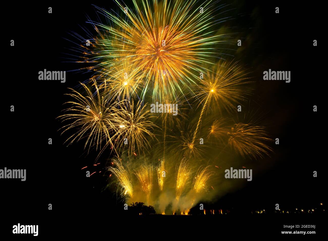 Huge, colorful fireworks over the rice fields at dusk Stock Photo - Alamy
