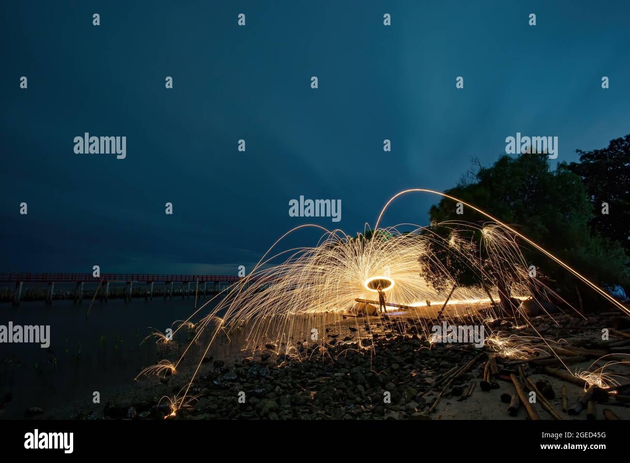 Playing with flames Holding a fire to cause flakes Stock Photo - Alamy