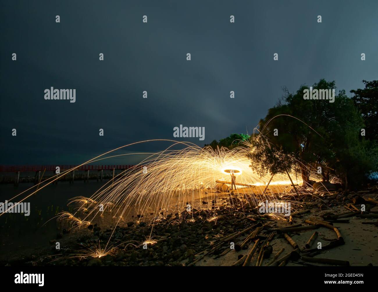 Playing with flames Holding a fire to cause flakes Stock Photo - Alamy