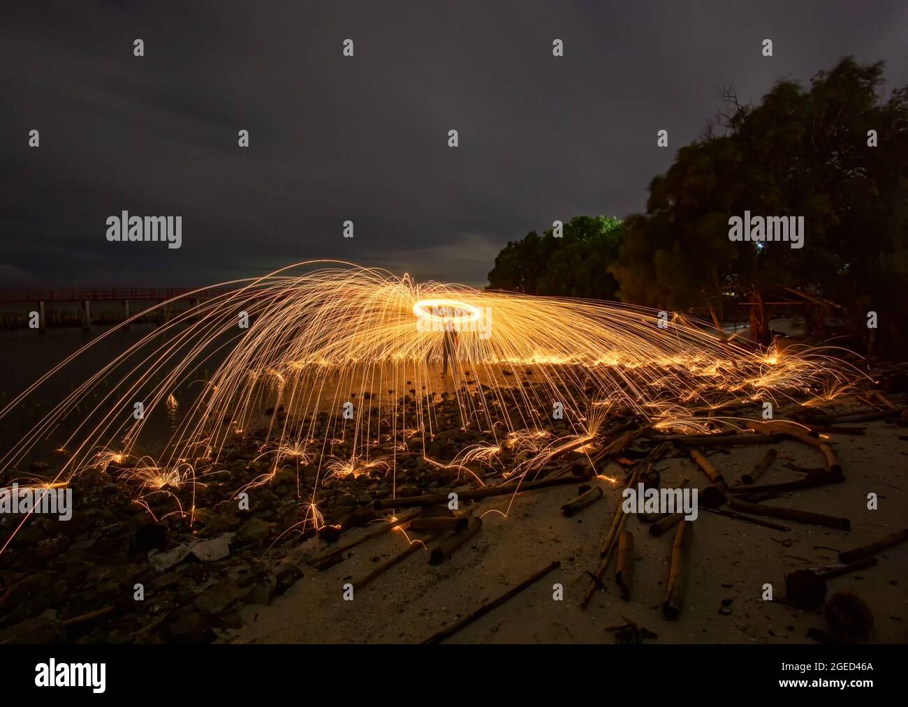 Playing with flames Holding a fire to cause flakes Stock Photo - Alamy