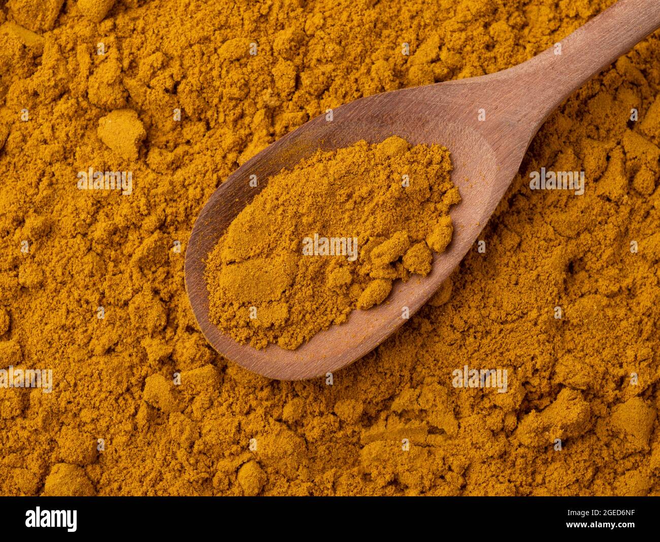 Top view, closeup of turmeric in a spoon. Food backdrop Stock Photo - Alamy