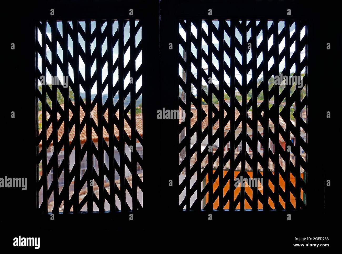 Colonial window with wooden truss in historical city of Diamantina ...