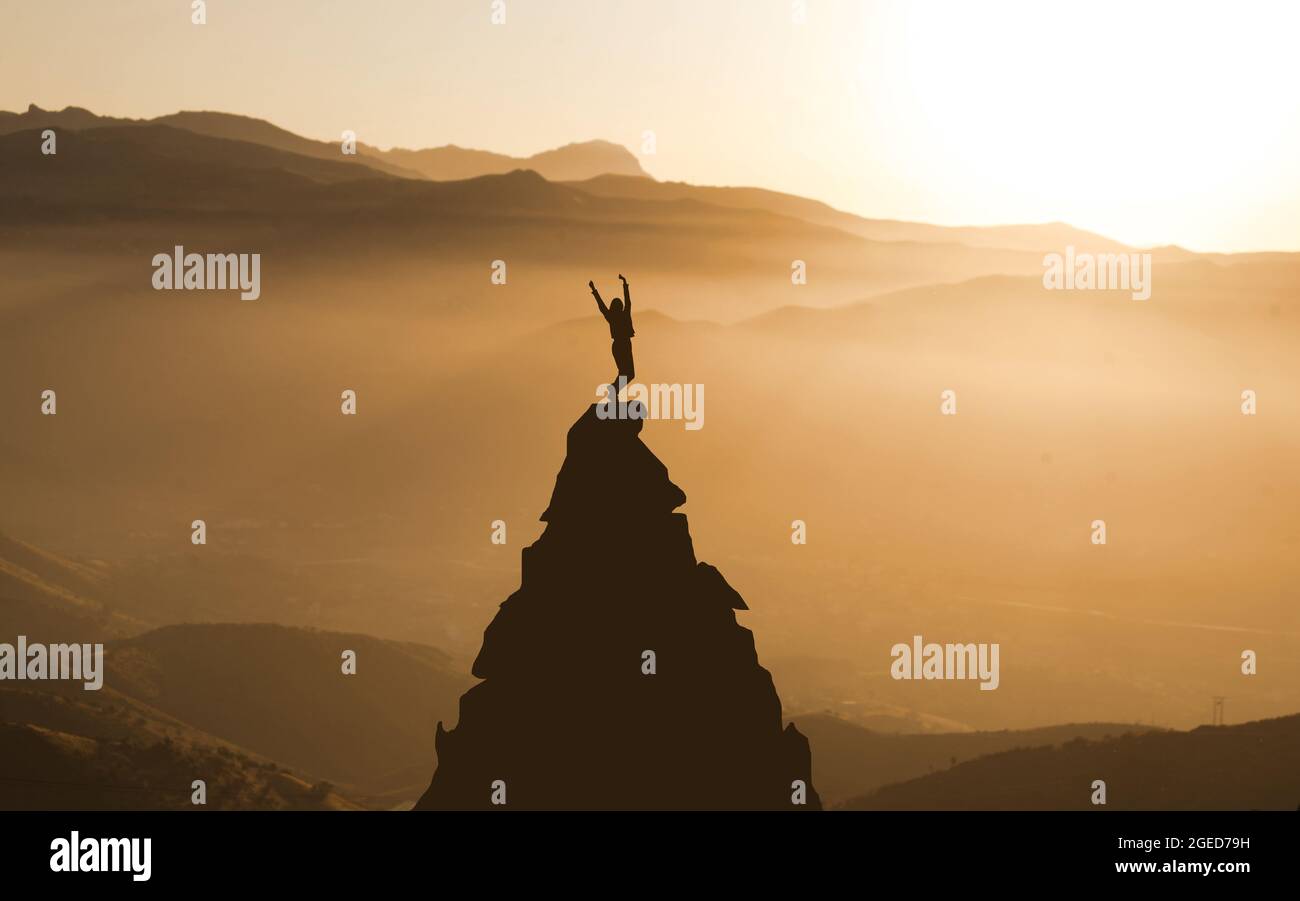 Happy Successful Girl Jumping On Mountain Peak. Top mountains Sunset ...