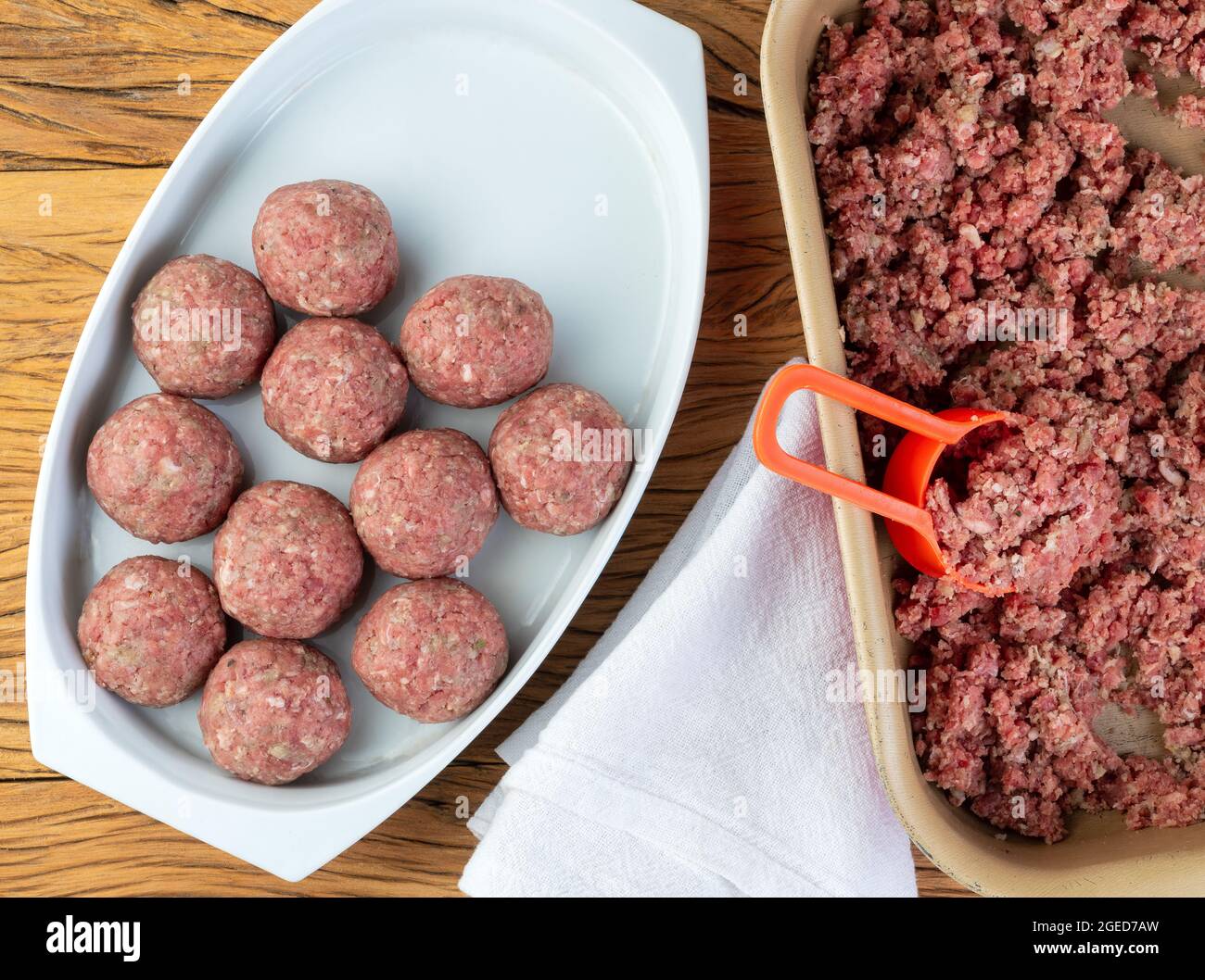 Raw meat balls being made with ground beef Stock Photo - Alamy