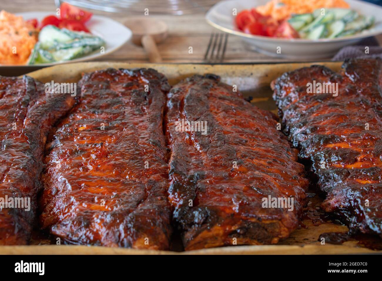 Spare ribs marinated and glazed whole racks on a baking sheet Stock ...