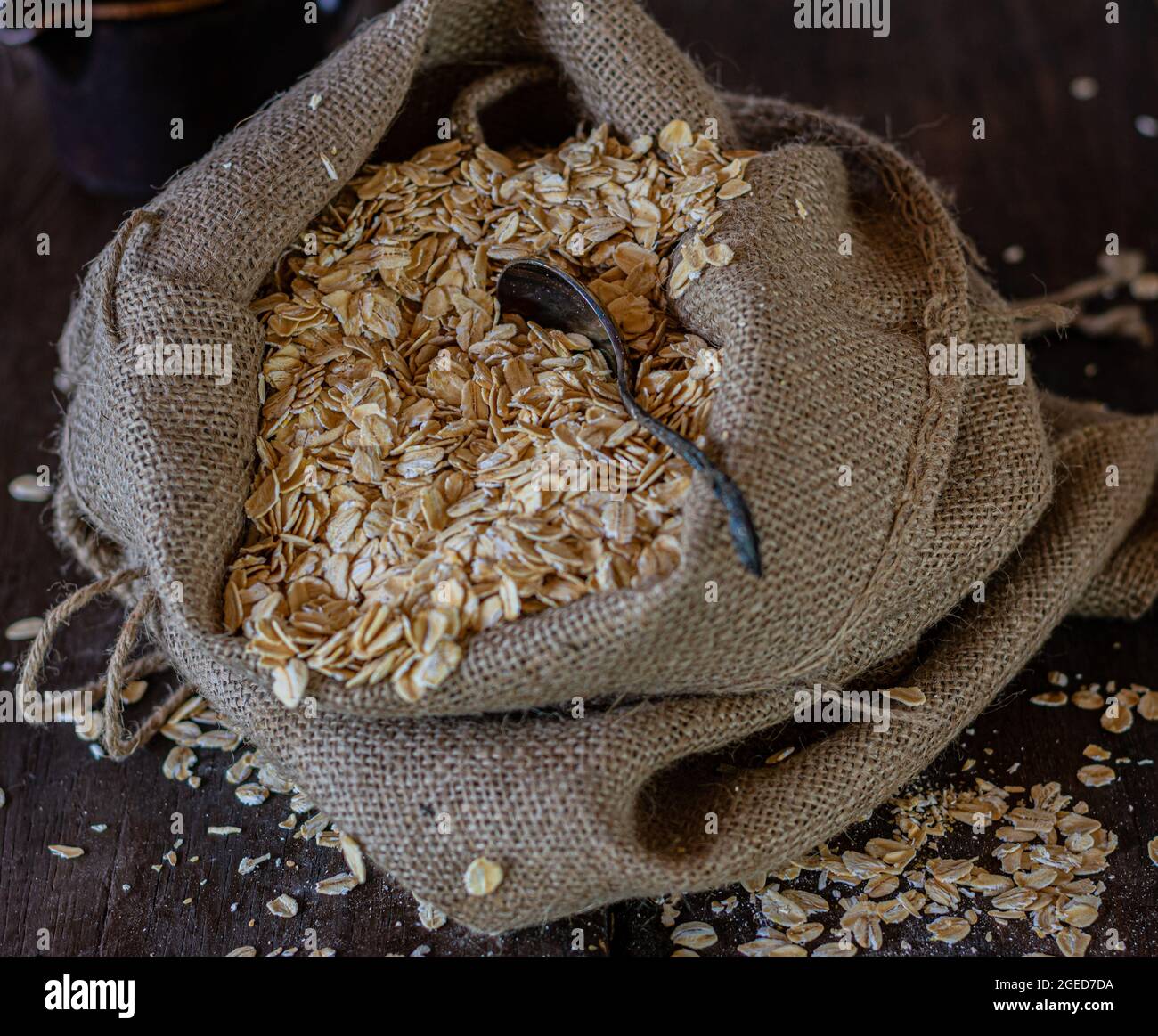 Rolled oats or oat flakes in jute bag Stock Photo - Alamy