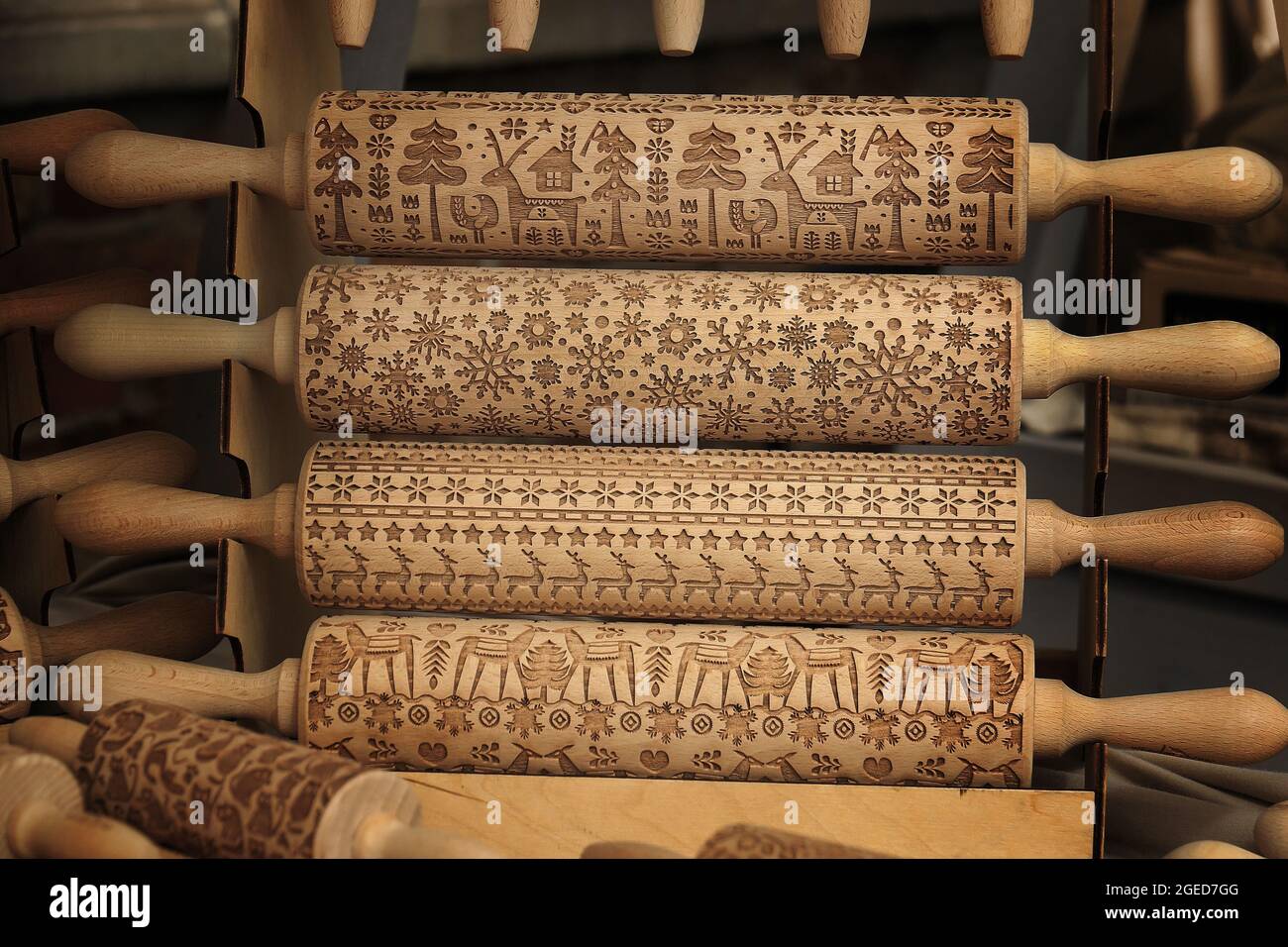 A display of wooden rolling pins with various Christmas designs Stock ...