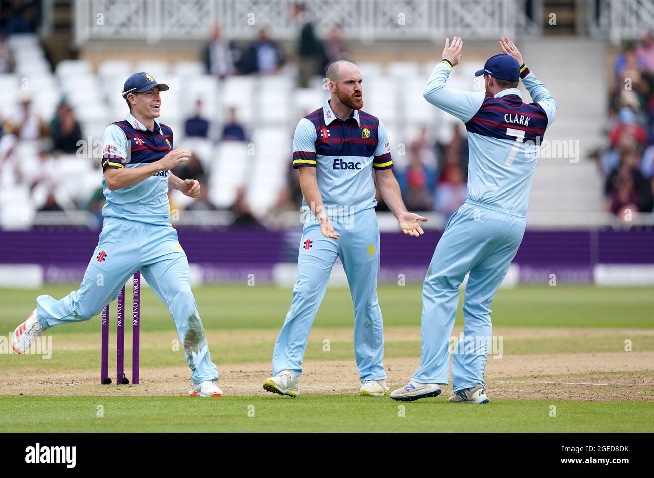 Durham's Ben Raine (centre) celebrates taking the wicket of Glamorgan's ...