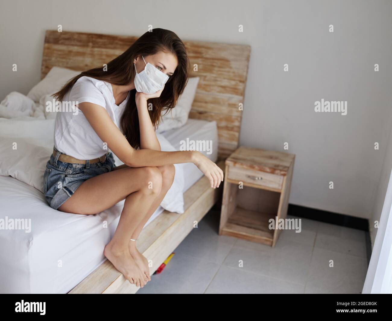 woman in medical mask quarantined on vacation isolation Stock Photo - Alamy
