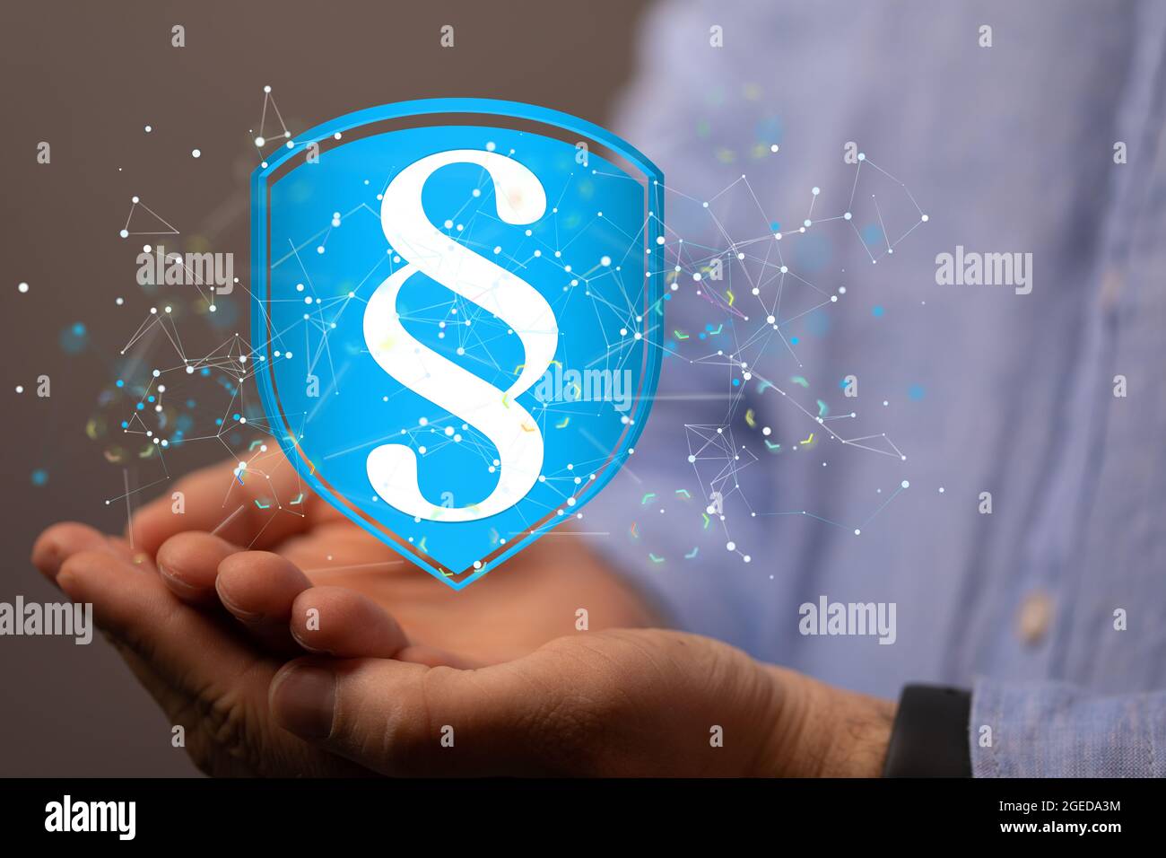 Man holding the icon of law in his hands Stock Photo - Alamy