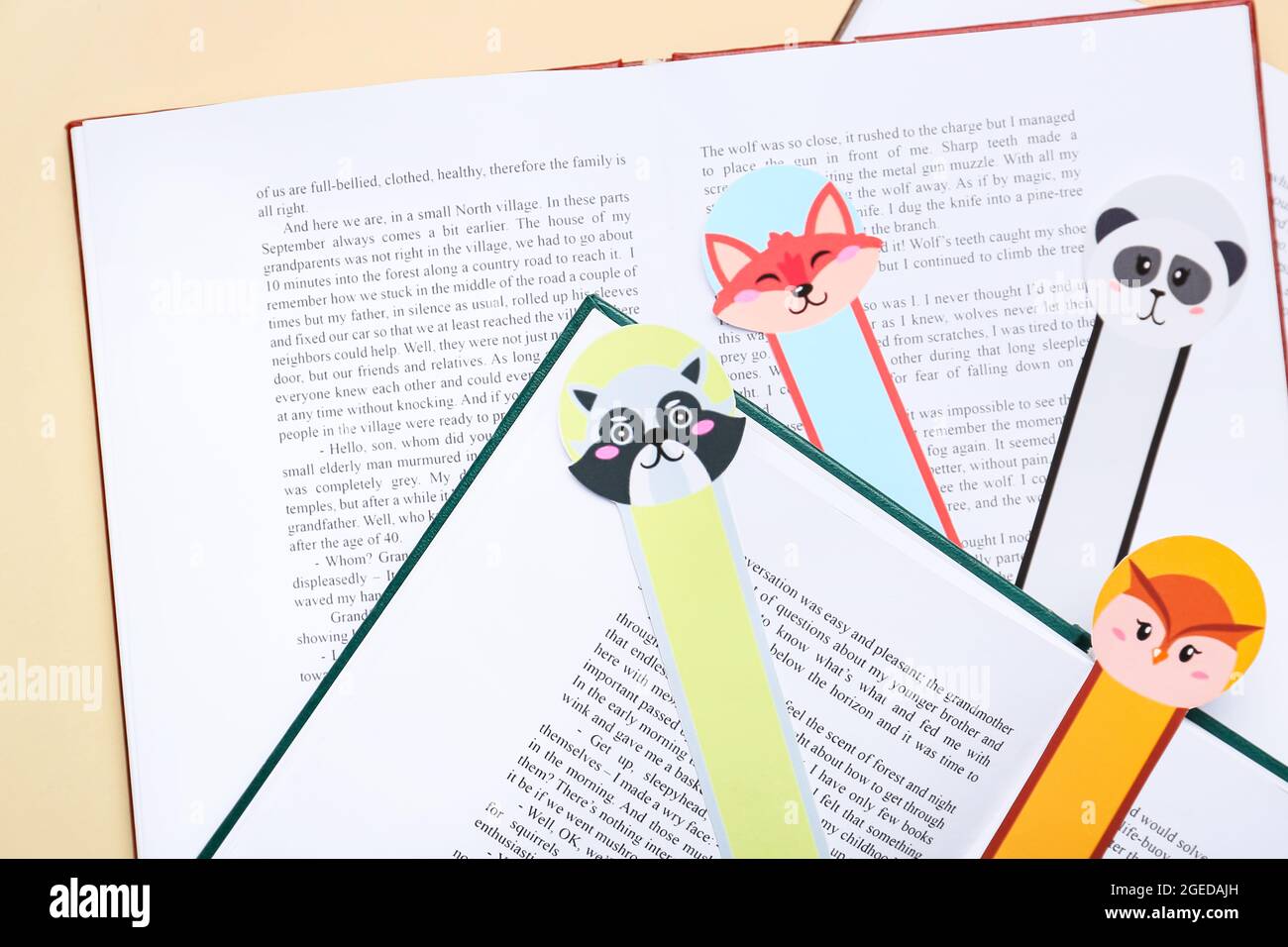 Cute bookmarks with books on color background Stock Photo - Alamy