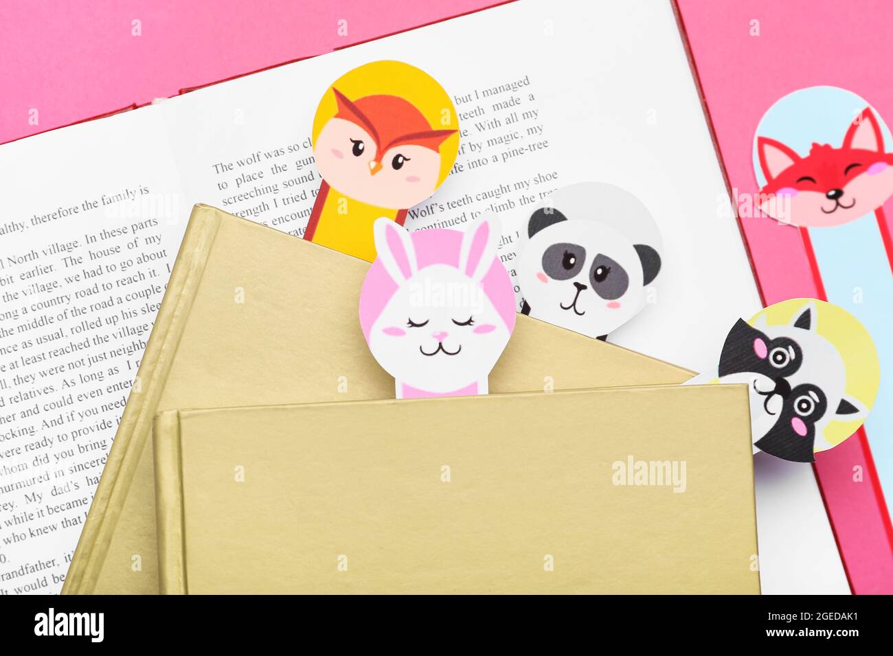 Cute bookmarks with books on color background Stock Photo - Alamy
