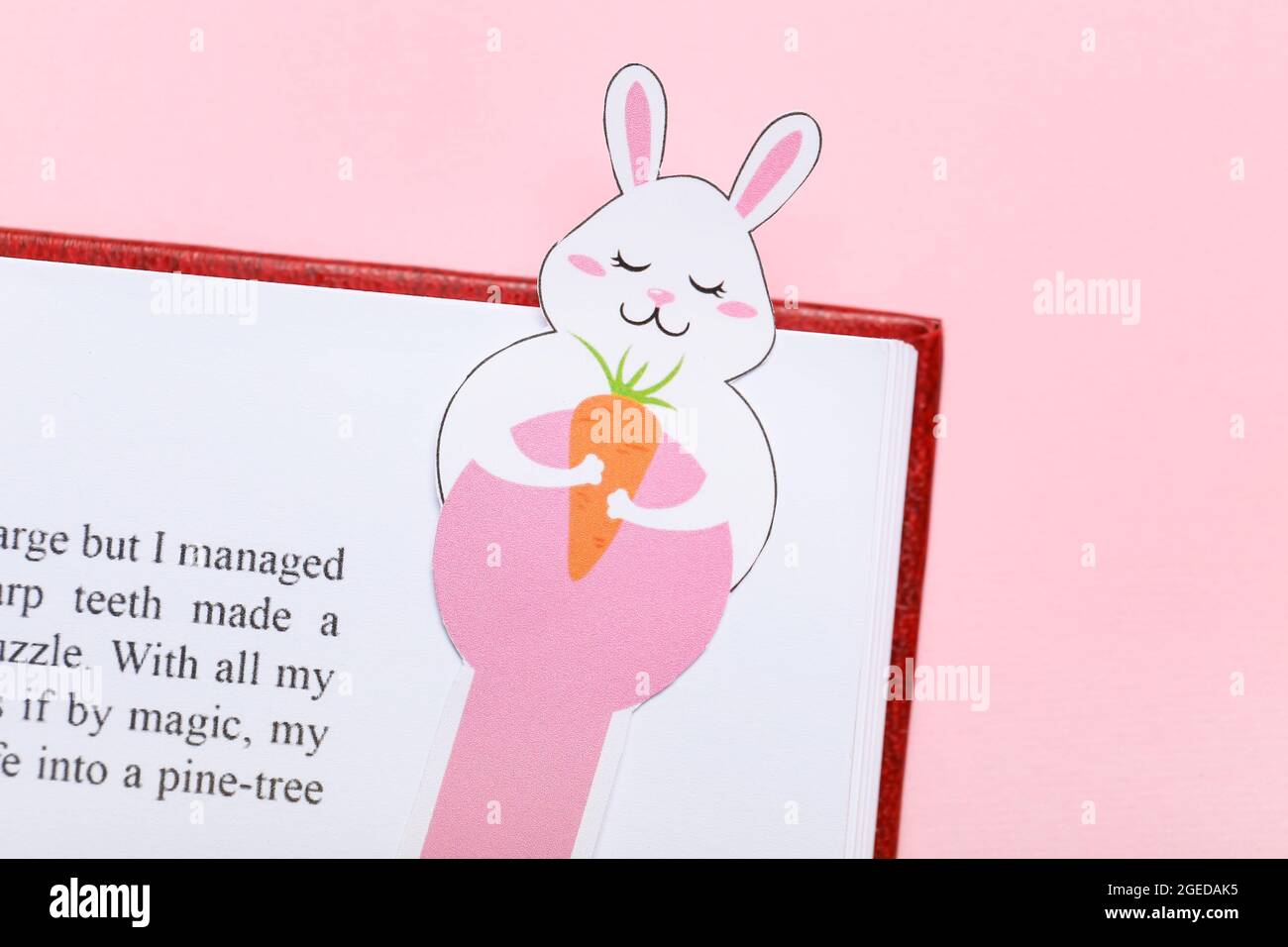 Cute bookmark with book on color background Stock Photo - Alamy