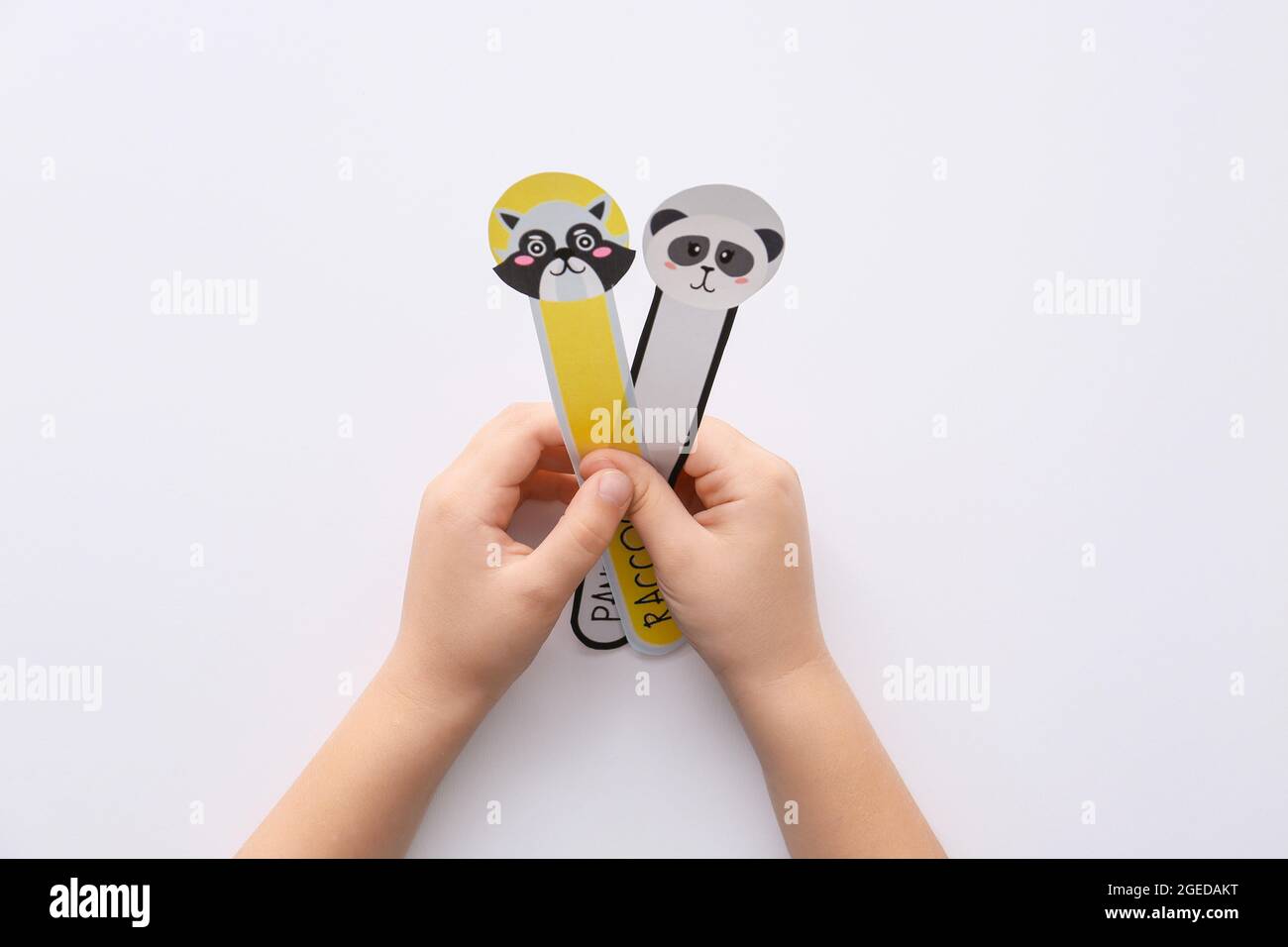 Hands of child with cute bookmarks on white background Stock Photo - Alamy