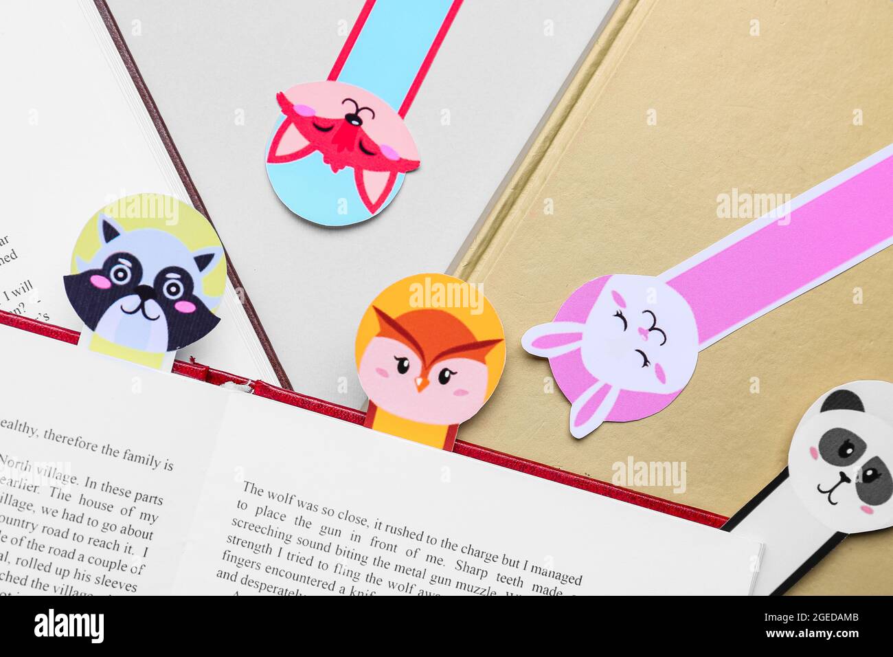 Cute bookmarks with books on light background Stock Photo - Alamy