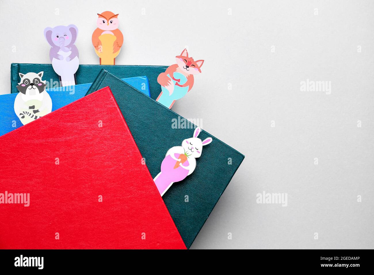 Cute bookmarks with books on grey background Stock Photo - Alamy
