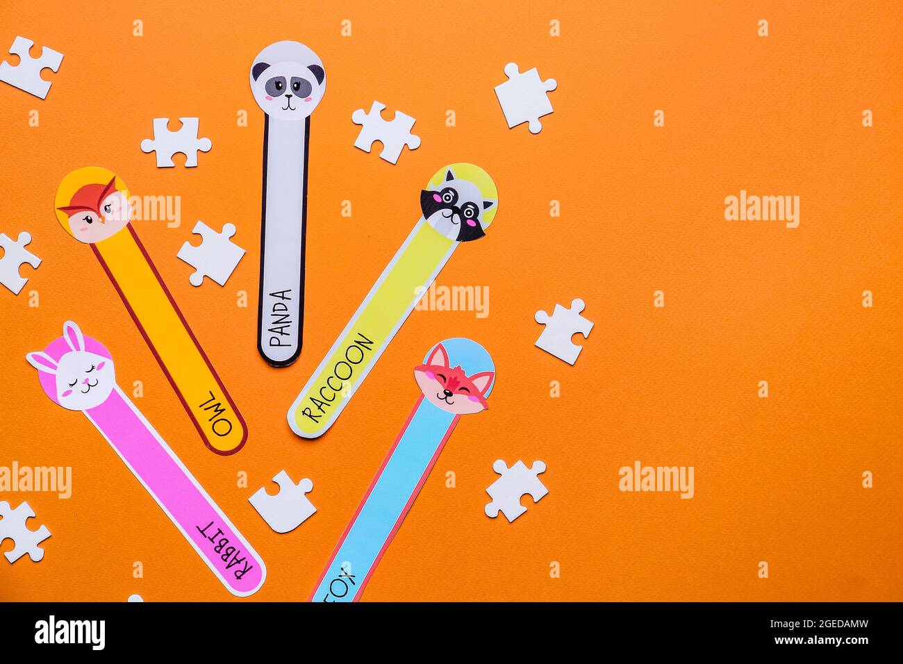 Cute bookmarks with puzzle pieces on color background Stock Photo - Alamy