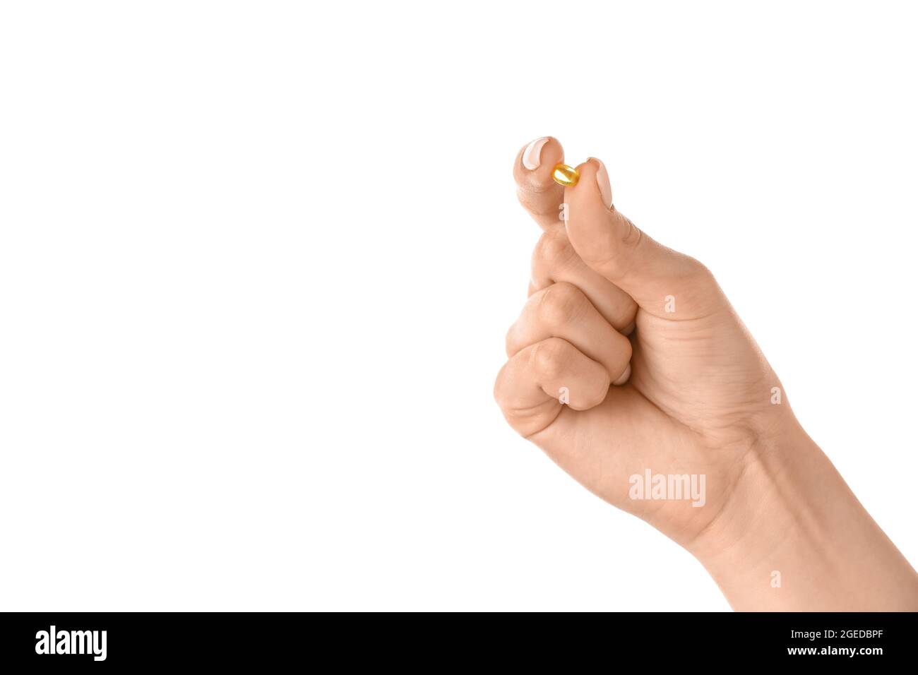 Female hand and pill on white background Stock Photo - Alamy