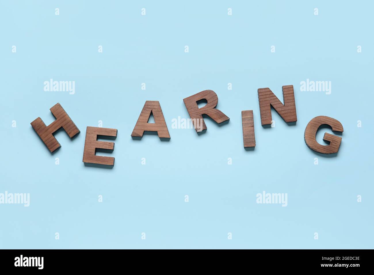 Word HEARING on color background Stock Photo - Alamy