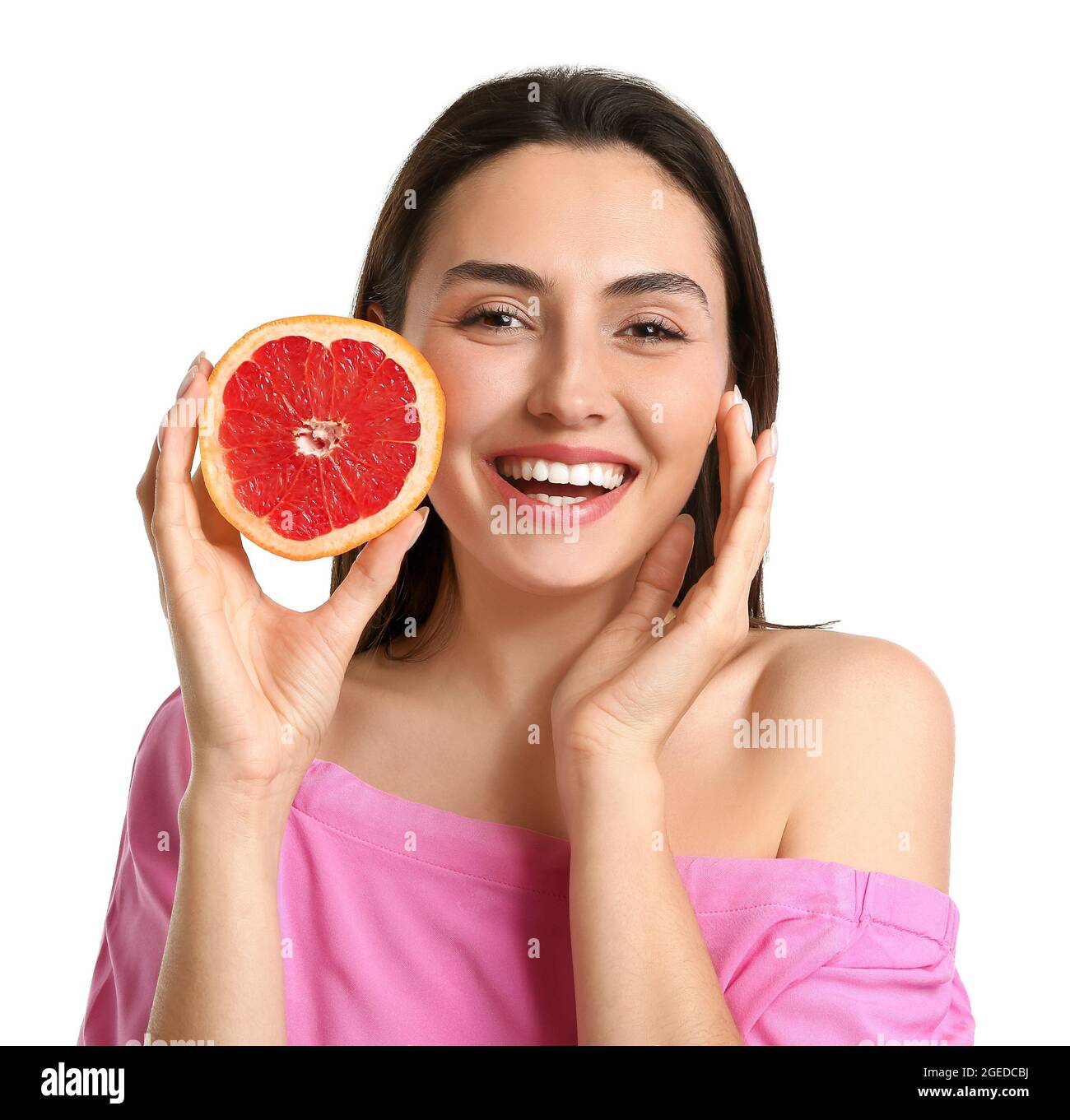 Beautiful woman with grapefruit on white background Stock Photo - Alamy