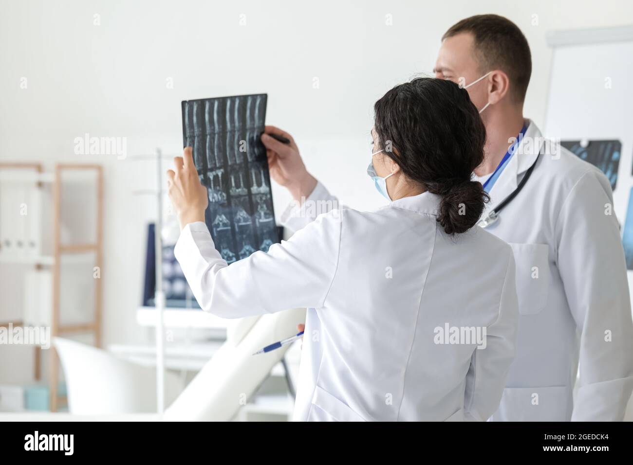 Doctors studying x-ray scan in clinic Stock Photo - Alamy