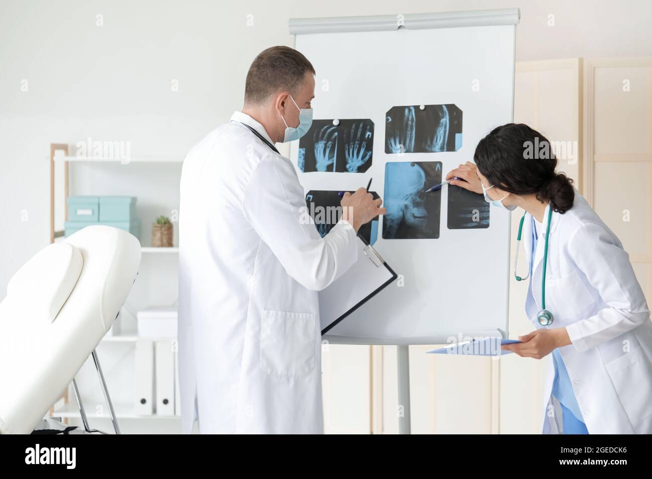 Doctors studying x-ray scans in clinic Stock Photo - Alamy