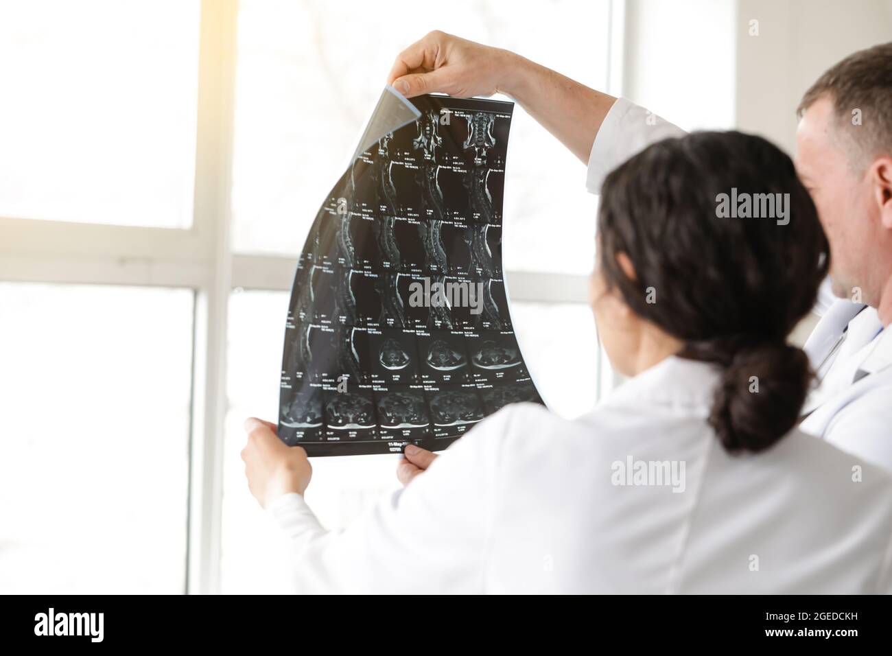 Doctors studying x-ray scan in clinic Stock Photo - Alamy