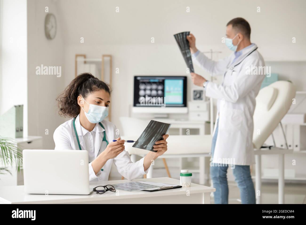 Female doctor studying x-ray scan in clinic Stock Photo - Alamy