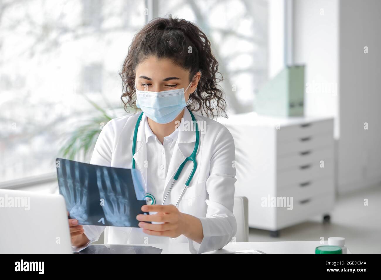 Female doctor studying x-ray scan in clinic Stock Photo - Alamy