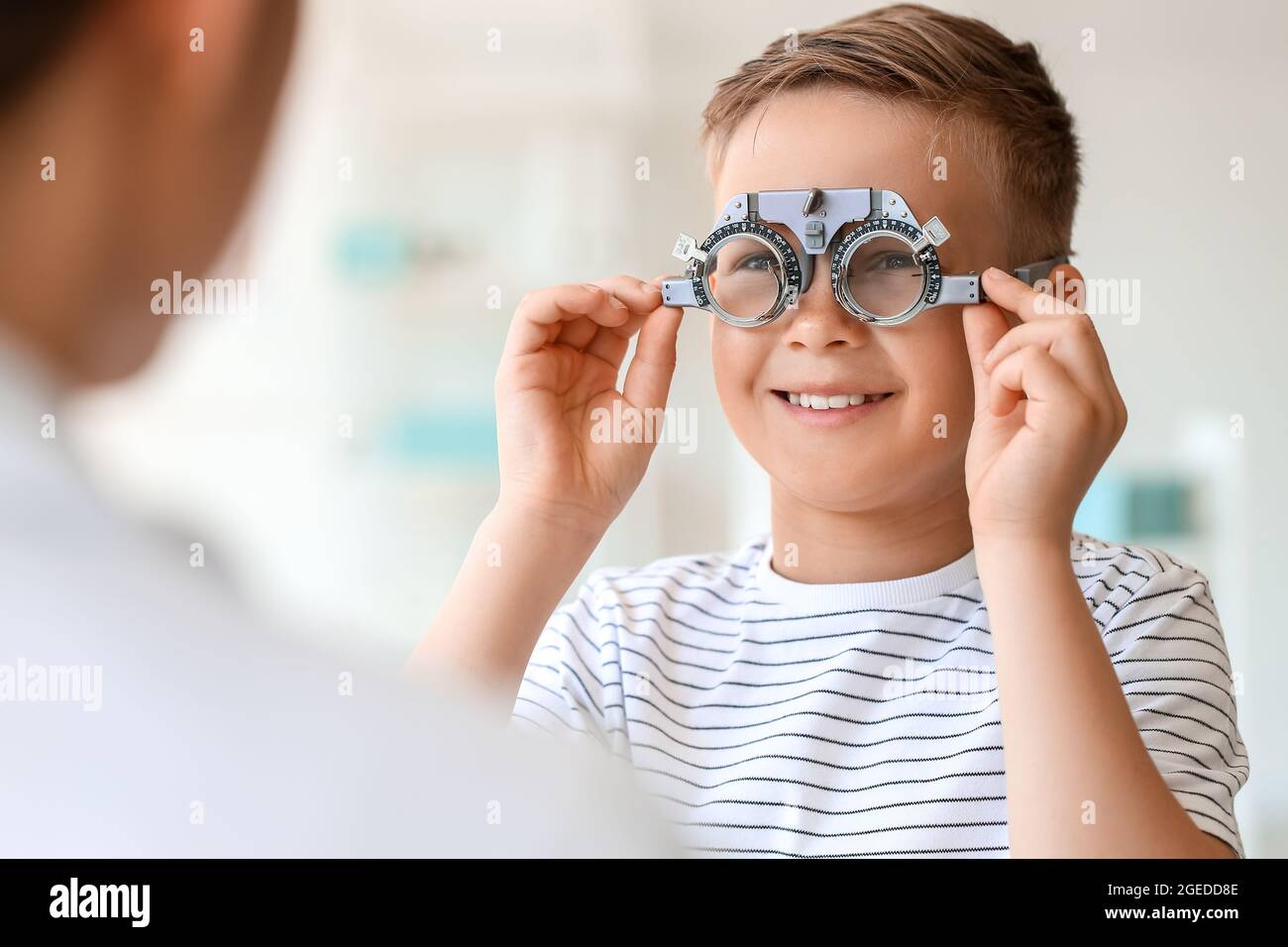 Little boy undergoing eye test in clinic Stock Photo - Alamy
