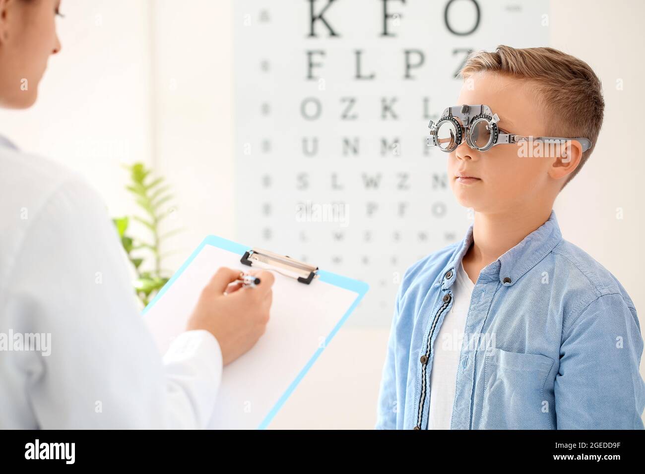 Little boy undergoing eye test in clinic Stock Photo - Alamy