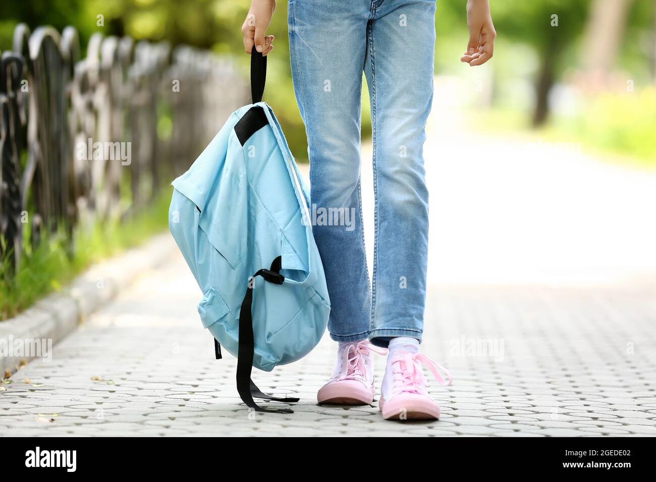 Little schoolgirl with backpack outdoors Stock Photo - Alamy